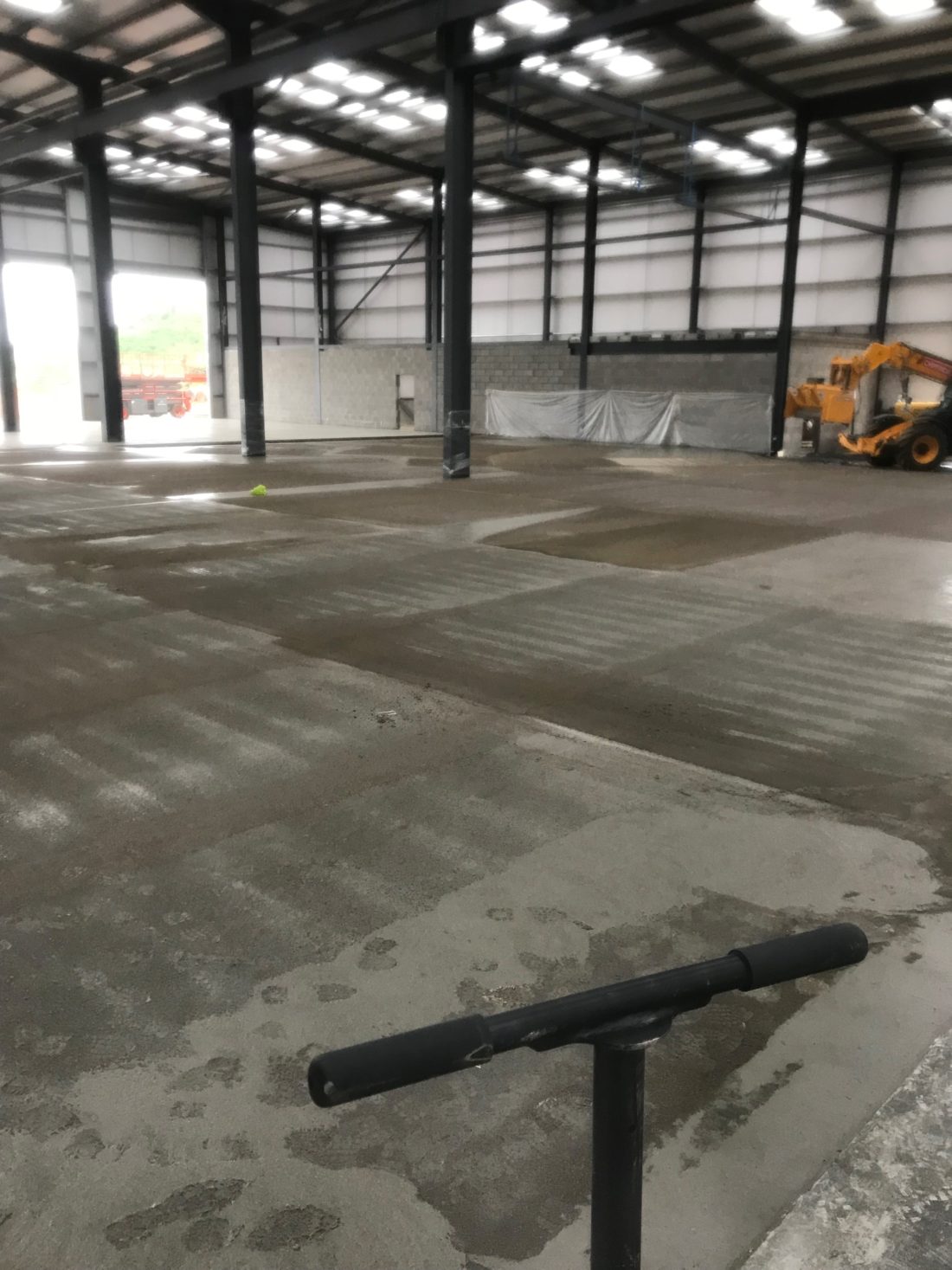 Dry shake applied to surface of the concrete slab - Level Best Concrete ...